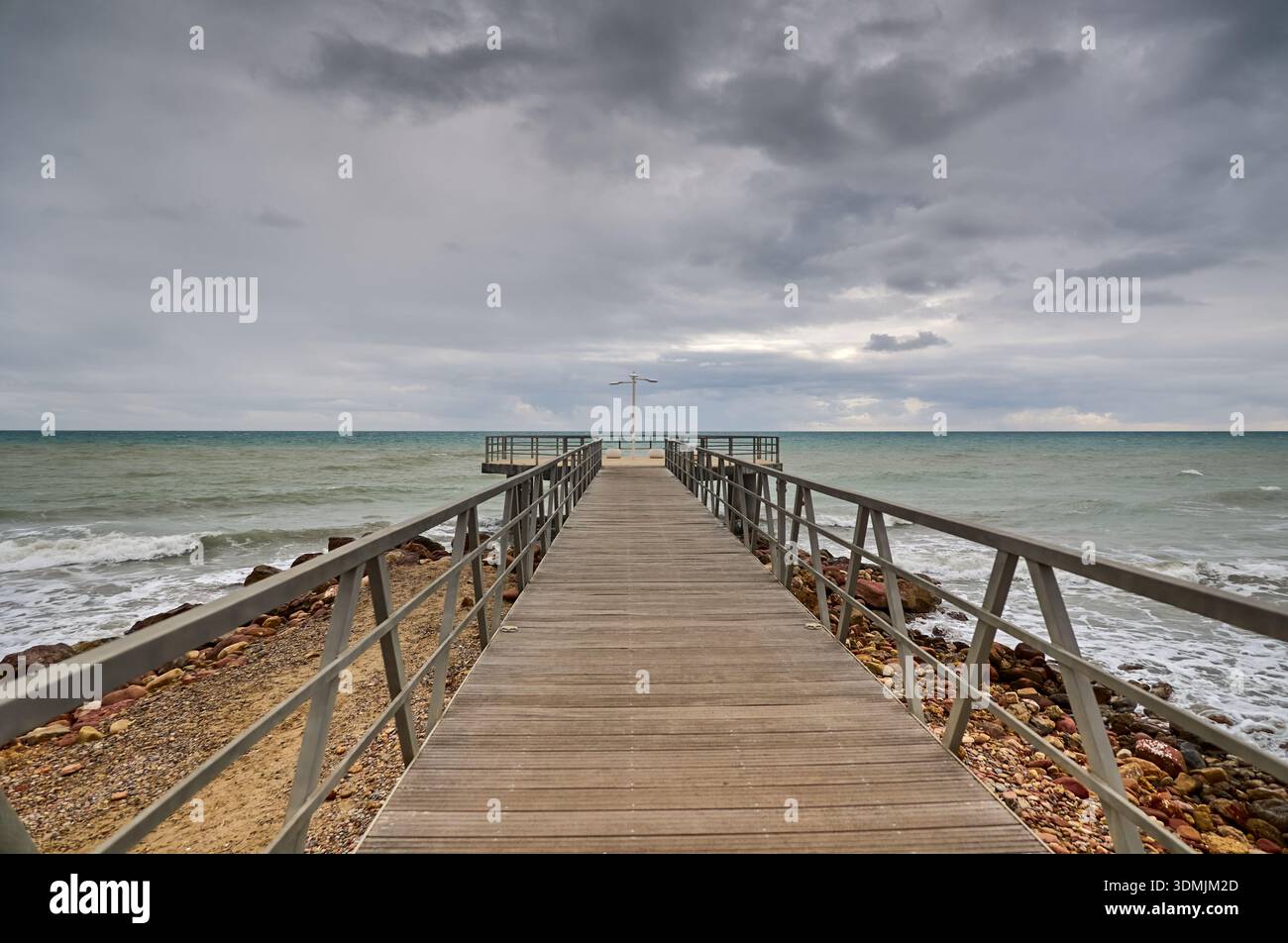 Minimalist perspective of a wooden pier leading into the Mediterranean ...