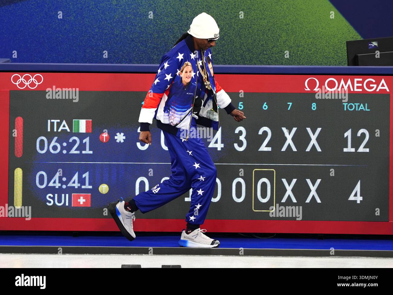 American rapper Snoop Dogg makes his way to the rink at the Cortina ...