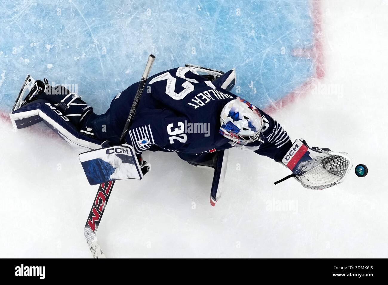 France's Alice Philbert catches the puck during a preliminary round ...