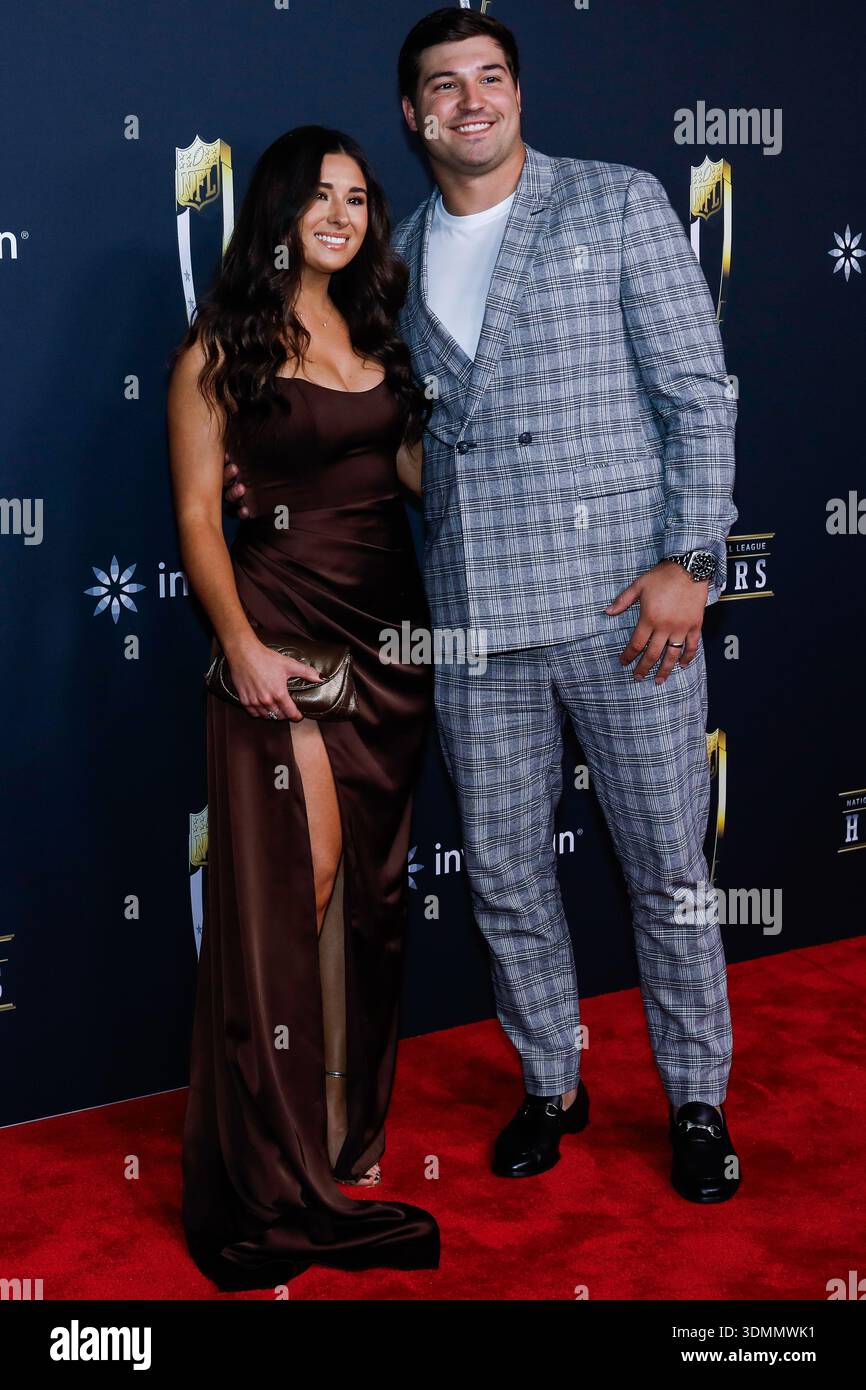 Allison Douglas and Ross Matiscik walking on the red carpet at NFL ...