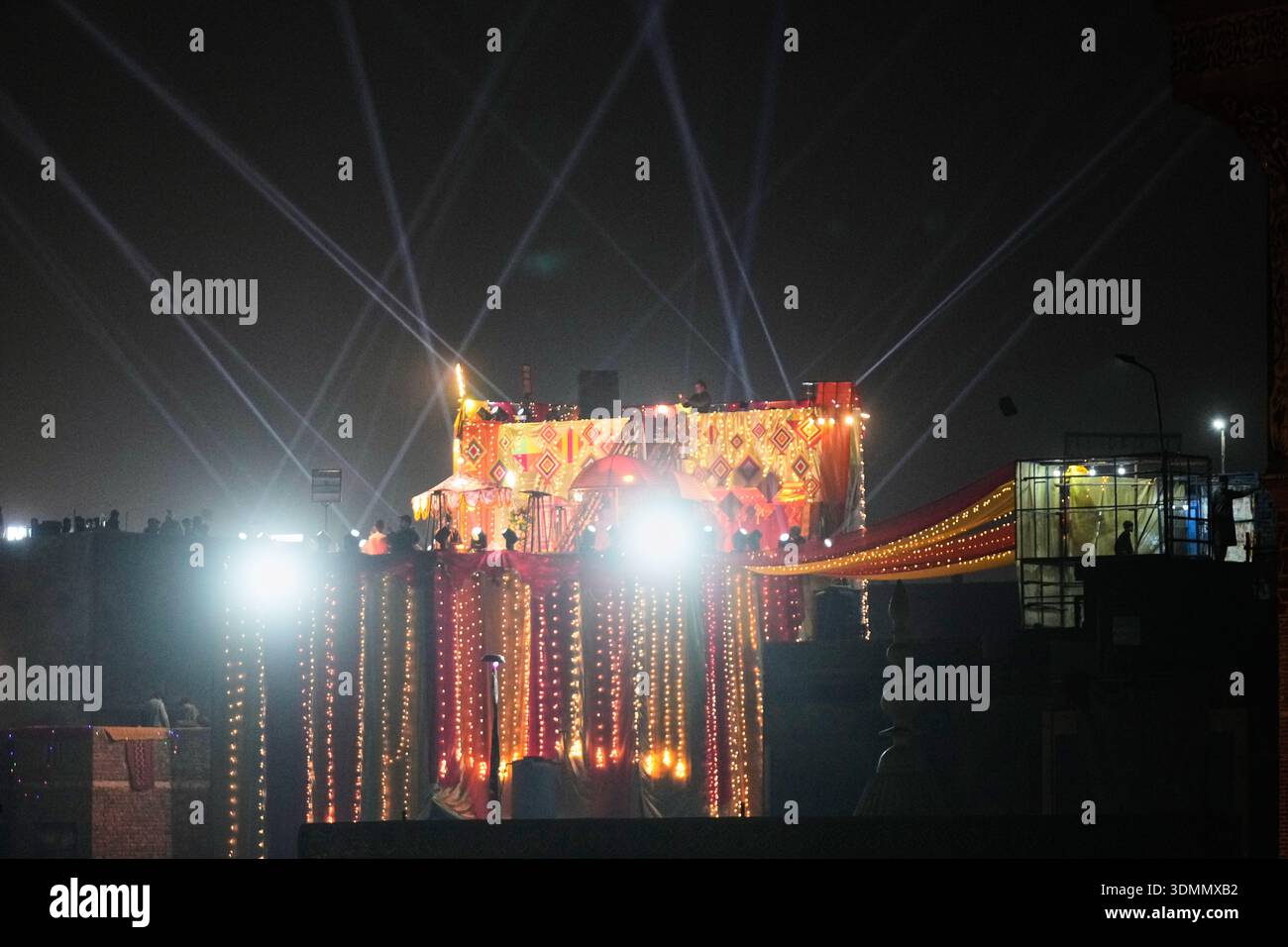 People gather on their decorated rooftops to celebrate the three-day ...