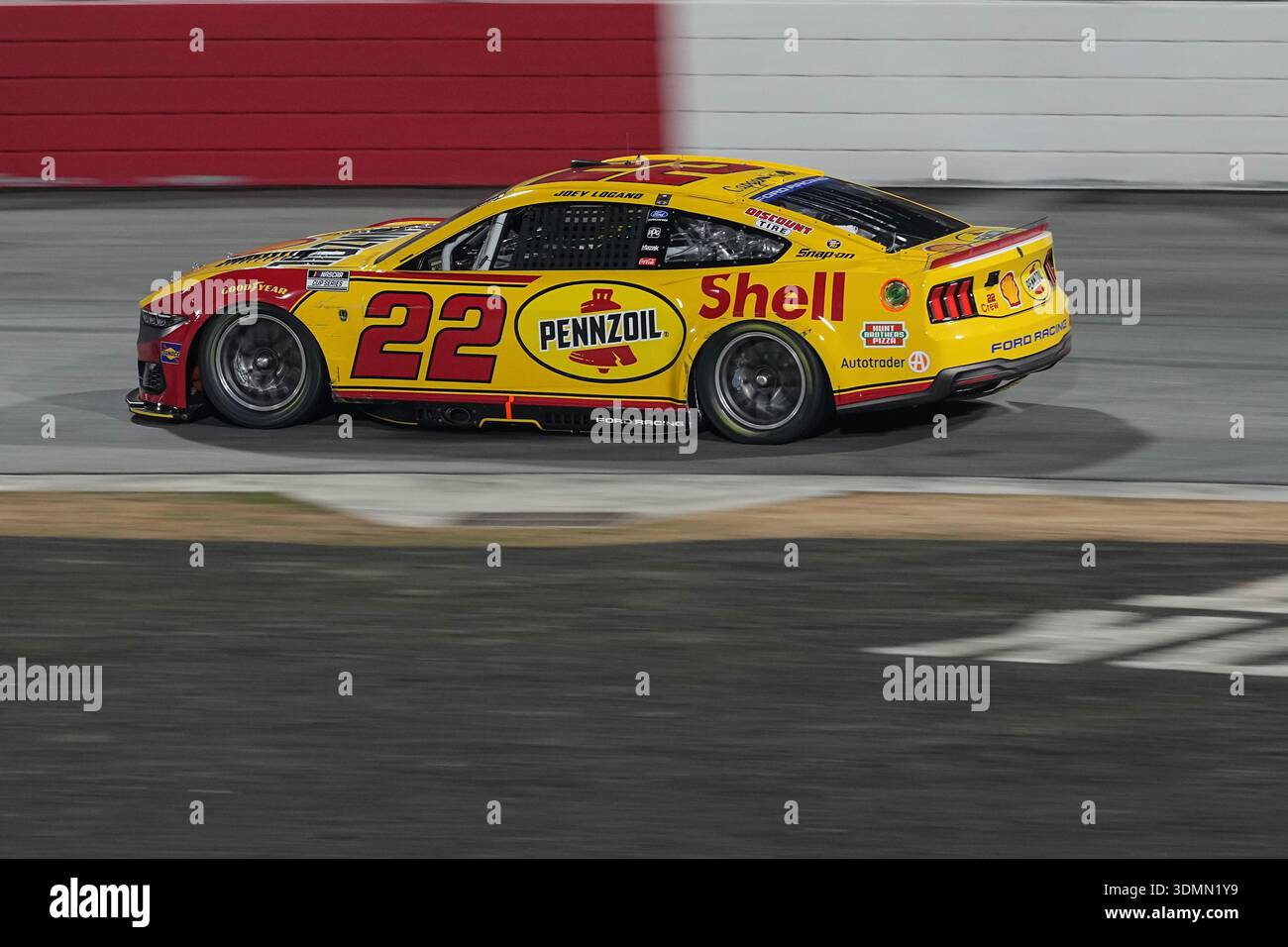 Joey Logano steers down the backstretch during NASCAR's The Clash ...