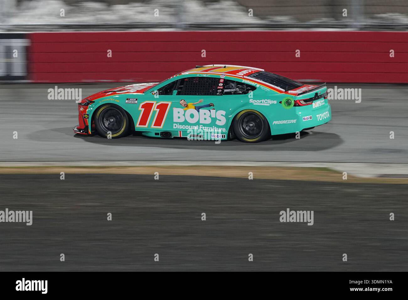 Denny Hamlin steers down the backstretch during NASCAR's The Clash ...