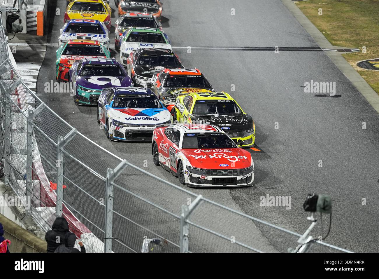 Ryan Preece (60) leads a pack of cars into Turn 1 during NASCAR's The ...