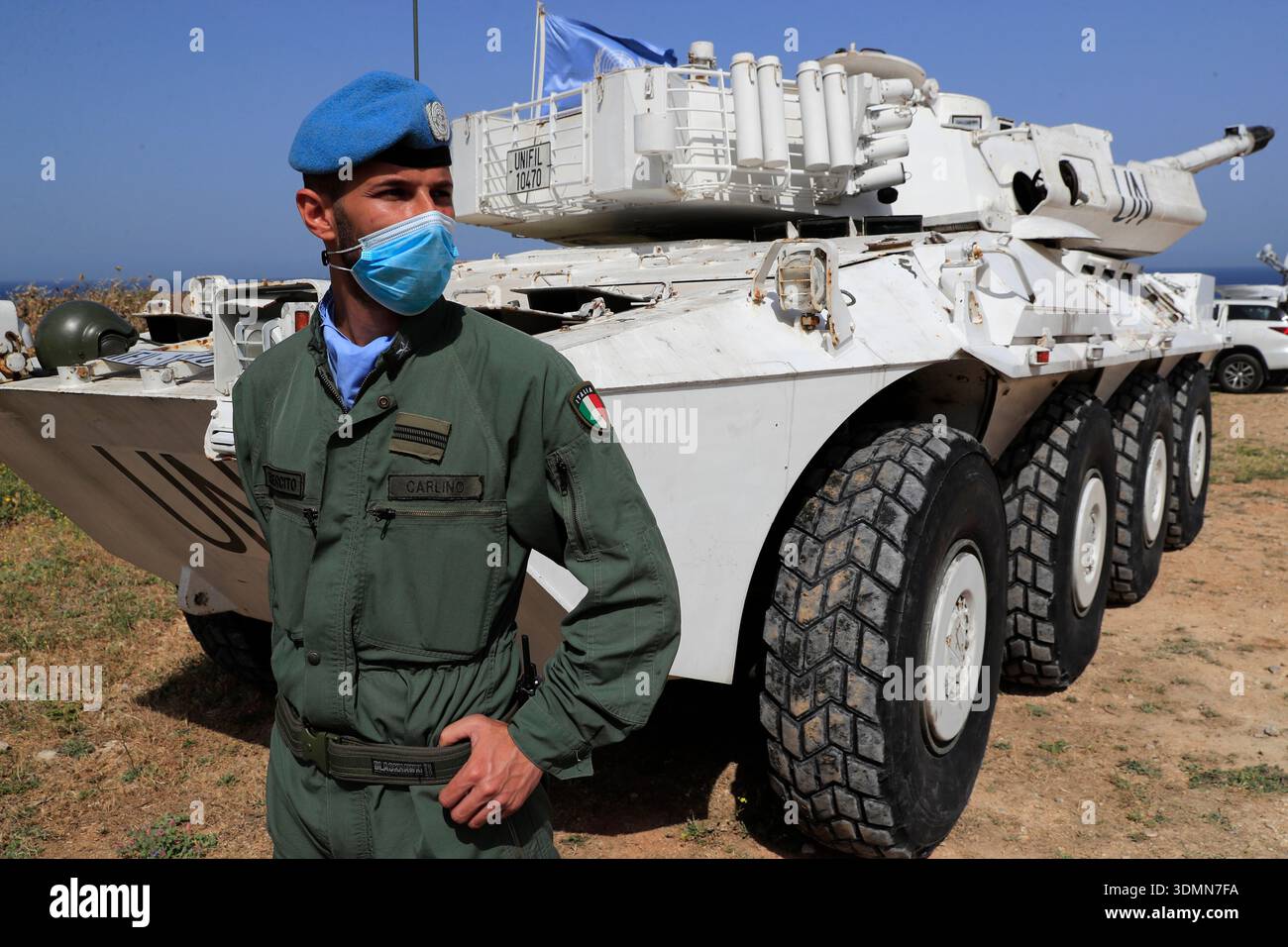 FILE - An Italian U.N. peacekeeper soldier stands guard at a road that ...