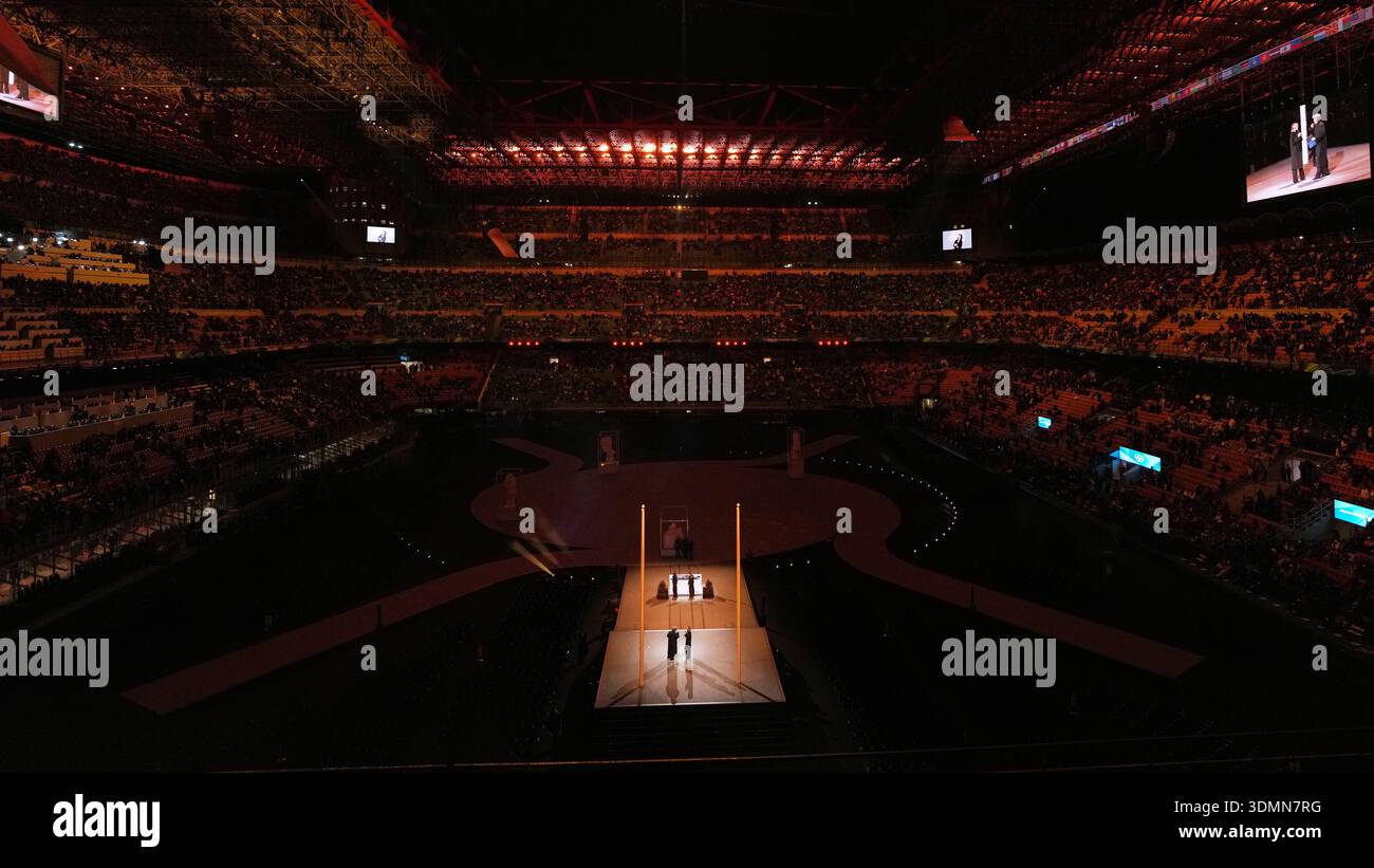 Spectators watch a pre-show ahead of the Olympic opening ceremony at ...