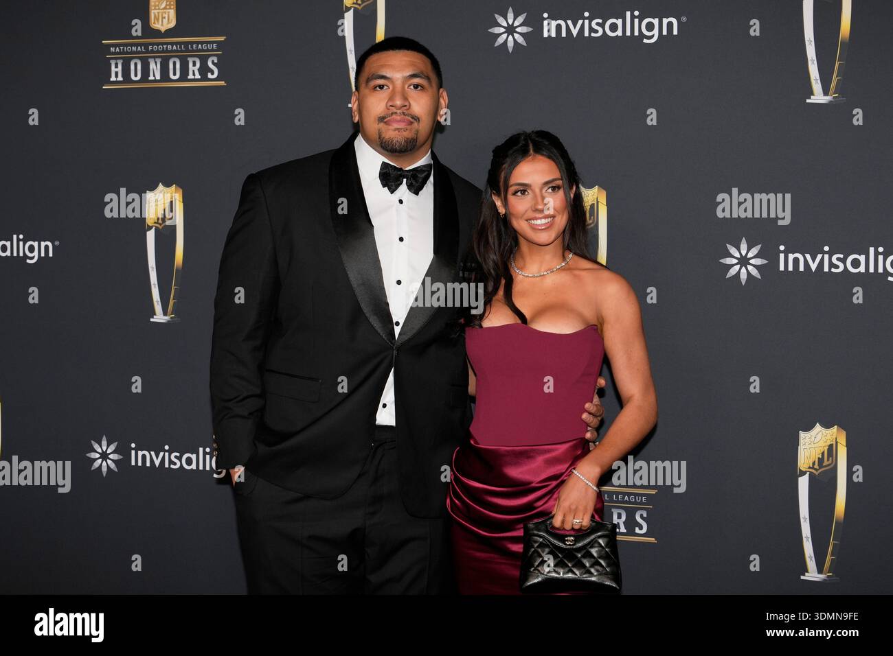 Detroit Lions' Penei Sewell, left, arrives with his wife, Isabelle, for ...