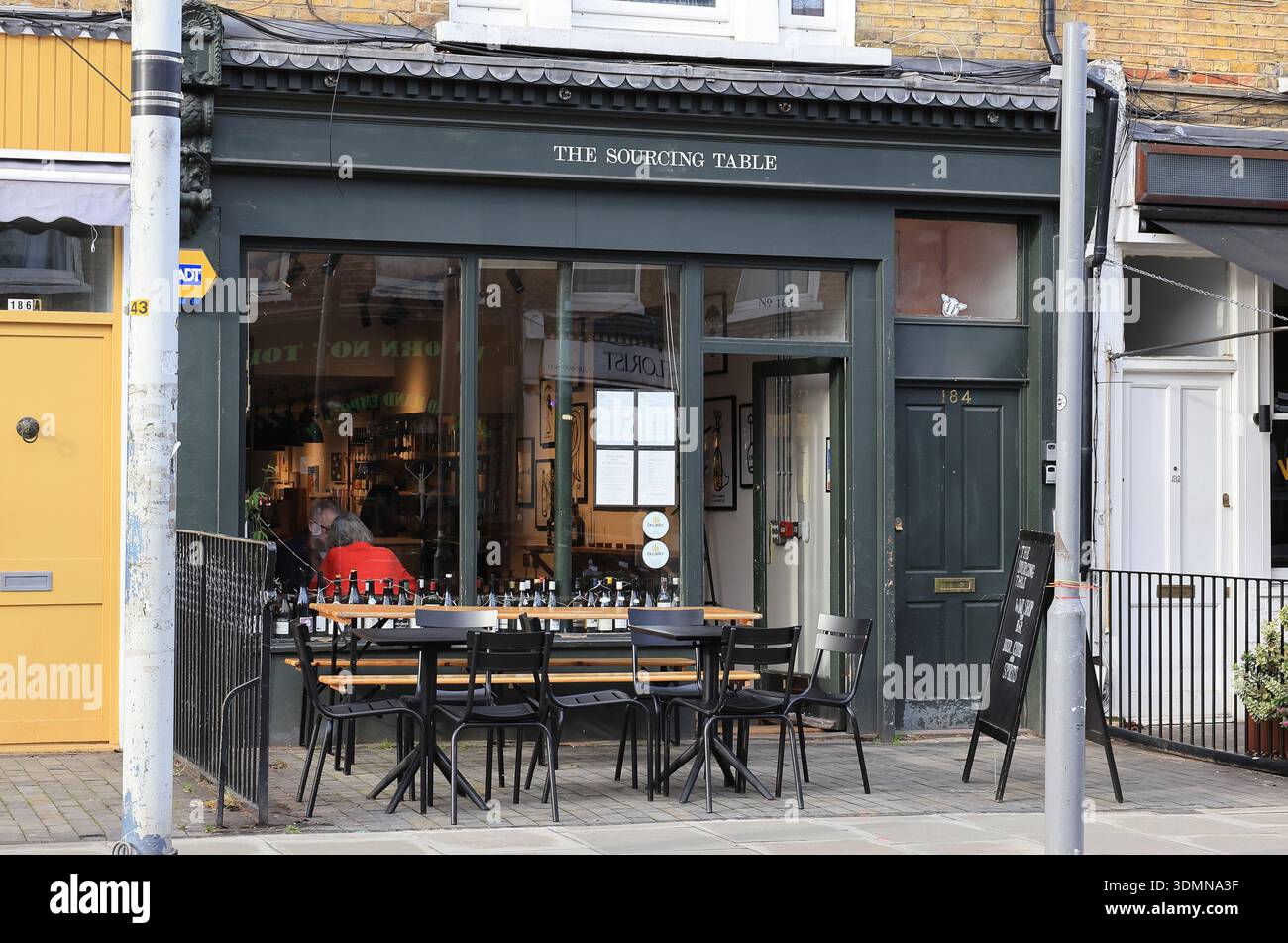 Shops and cafes on trendy Bellenden Road in Peckham, SE London, UK ...