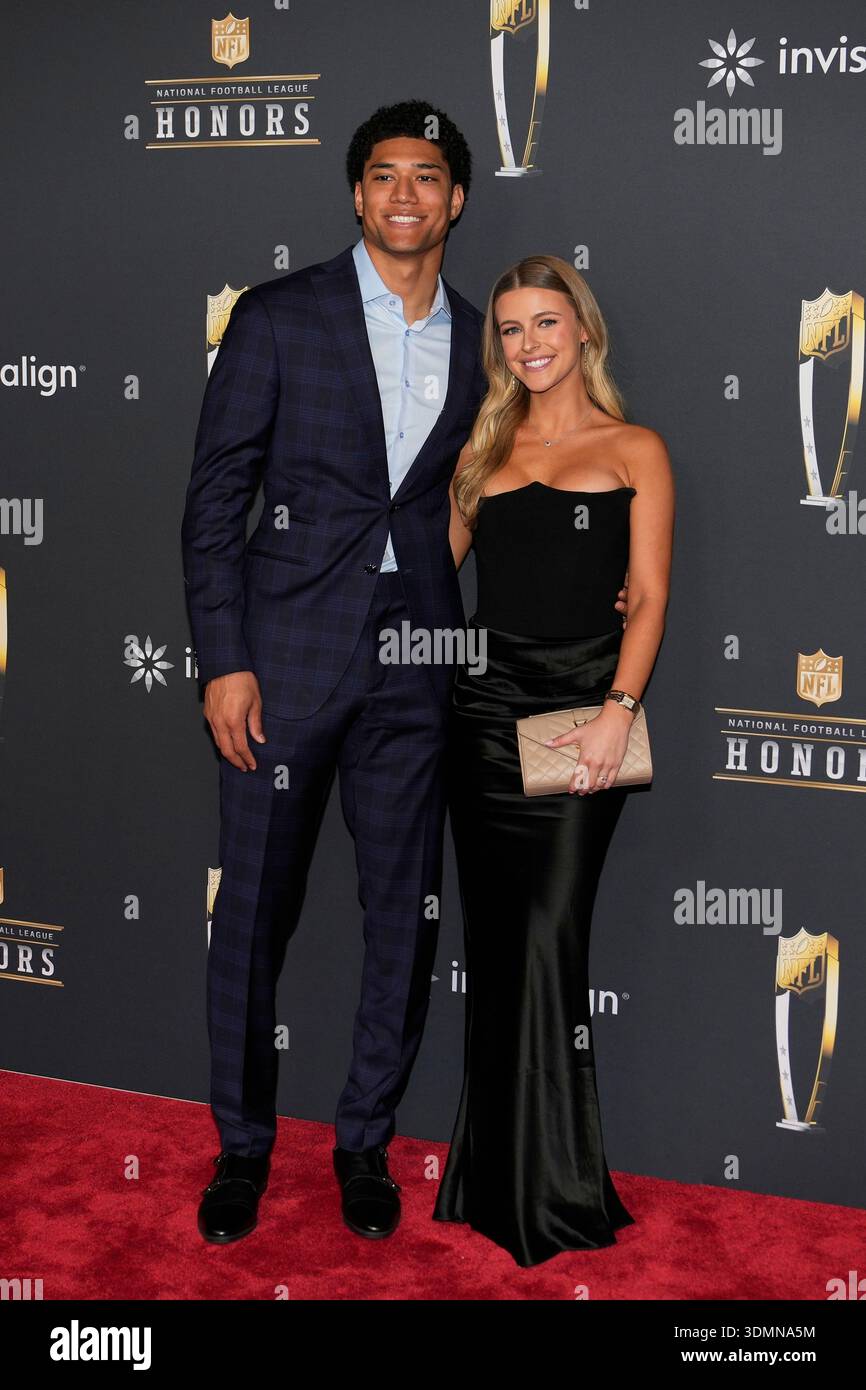 Baltimore Ravens' Kyle Hamilton, left, and Reese Damm arrive for ...