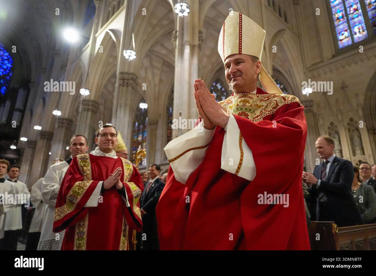Archbishop Ronald Hicks greets parishioners as he arrives for his Mass ...