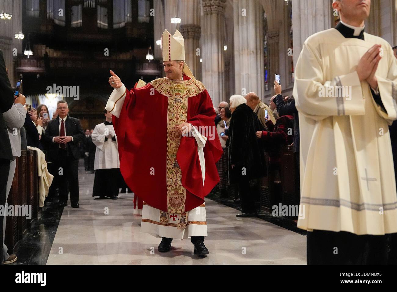 Archbishop Ronald Hicks greets parishioners as he arrives for his Mass ...