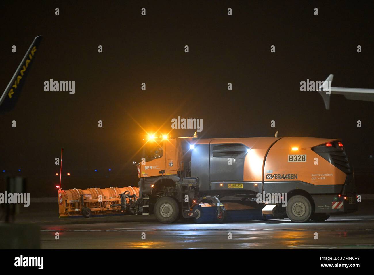 06 February 2026, Berlin: A snow clearing vehicle drives over the ...