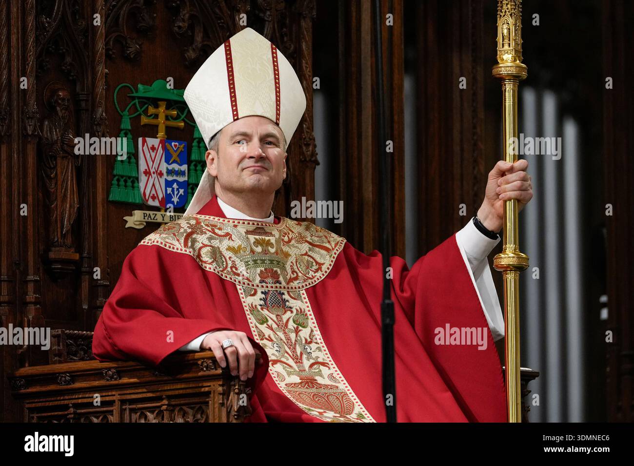Archbishop Ronald Hicks sits for the liturgy, during his Mass of ...