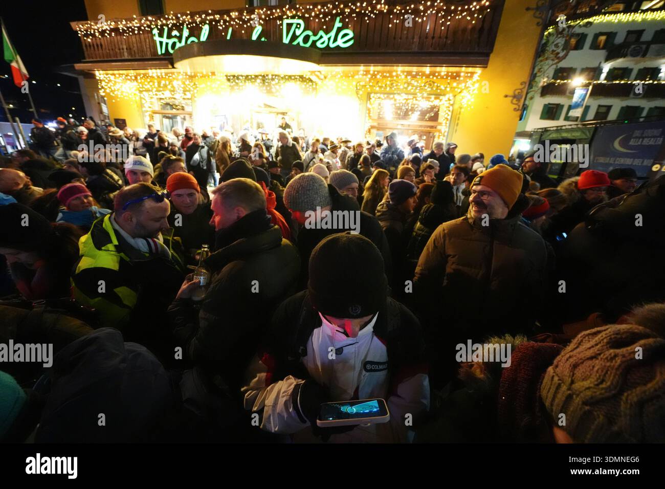 A person in Cortina d'Ampezzo watching the Milan Opening Ceremony on a ...