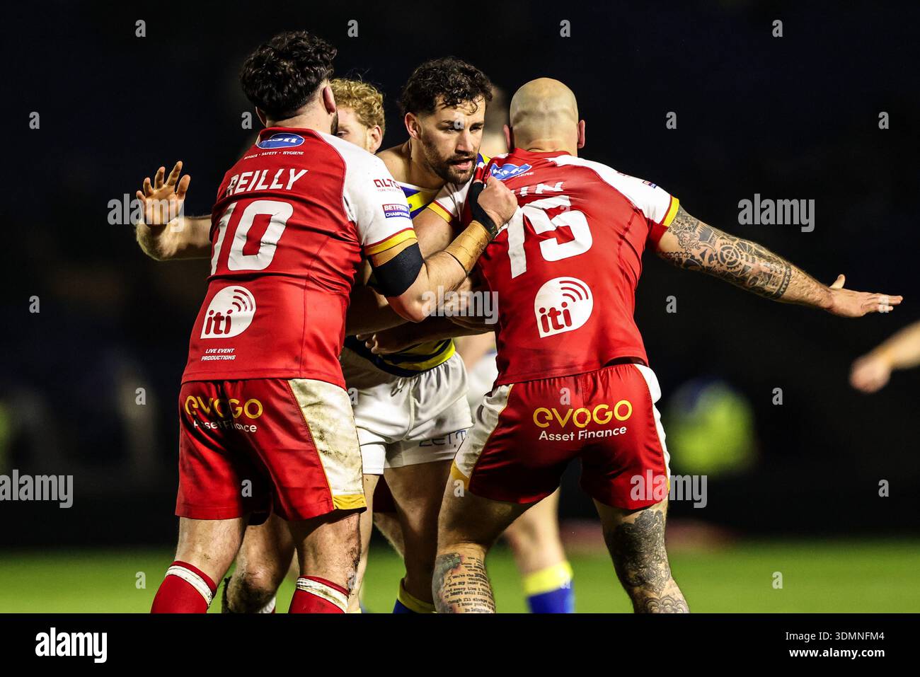 Toby King of Warrington Wolves is tackled during the Betfred Challenge ...