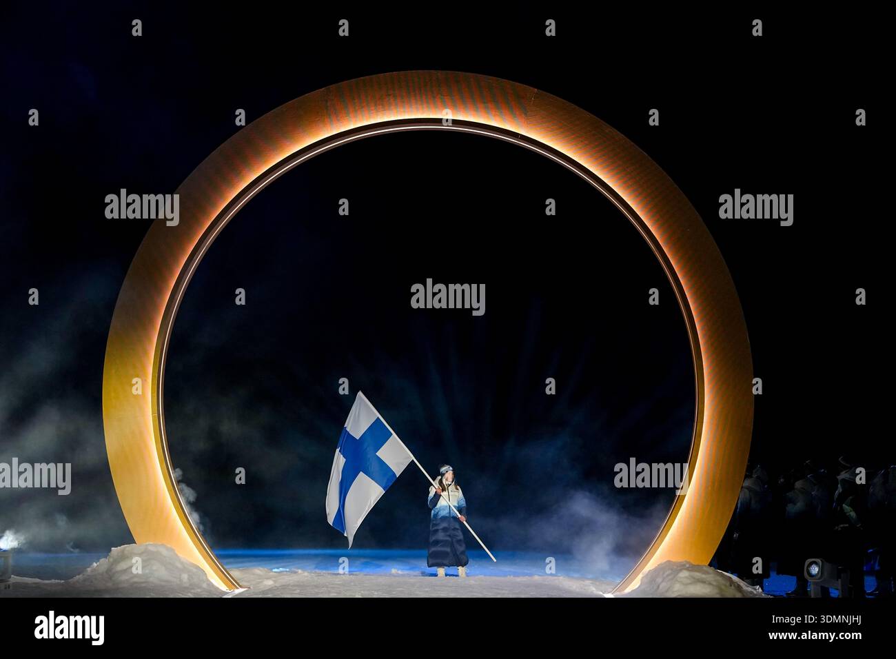 Krista Parmakoski, the flag bearer of Finland, takes part in the ...