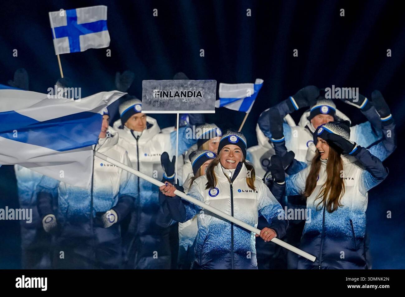 Krista Parmakoski, the flag bearer of Finland, takes part in the ...