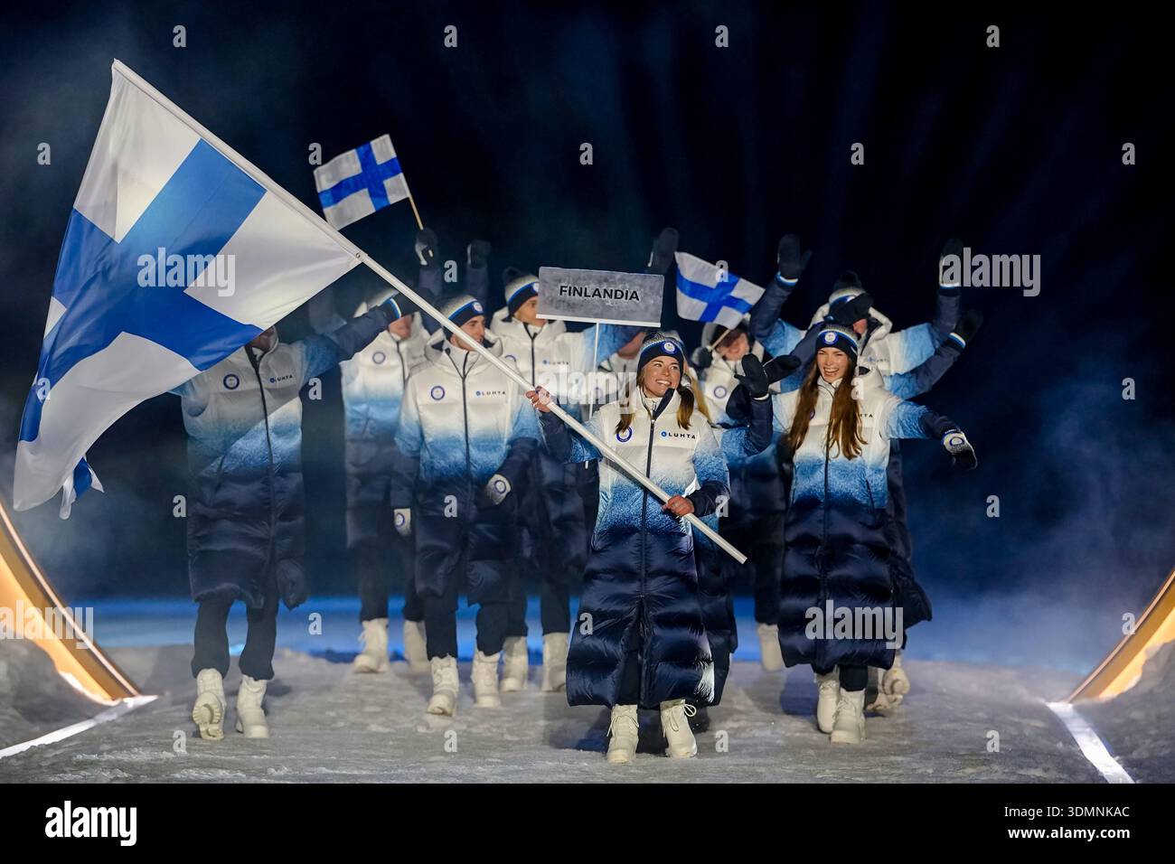 Krista Parmakoski, the flag bearer of Finland, takes part in the ...