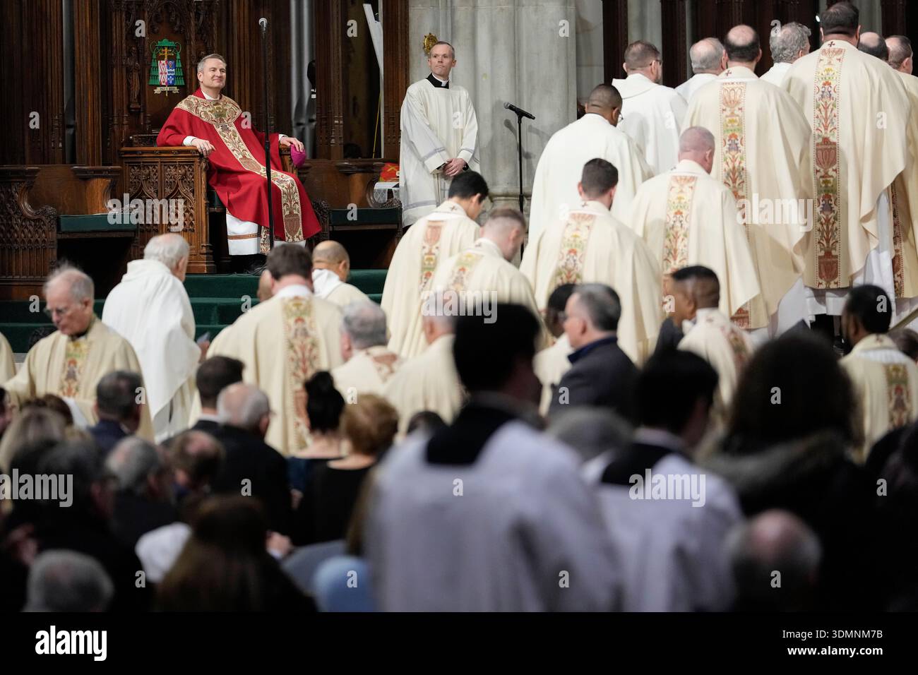 Archbishop Ronald Hicks sits for communion during his Mass of ...