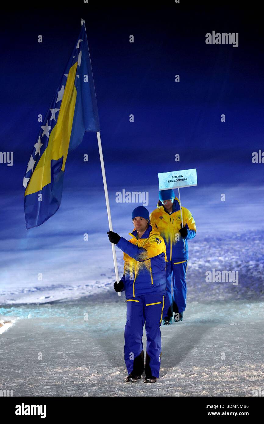 Bosnia and Herzegovina's flag bearer Marko Sljivic and his teammate ...