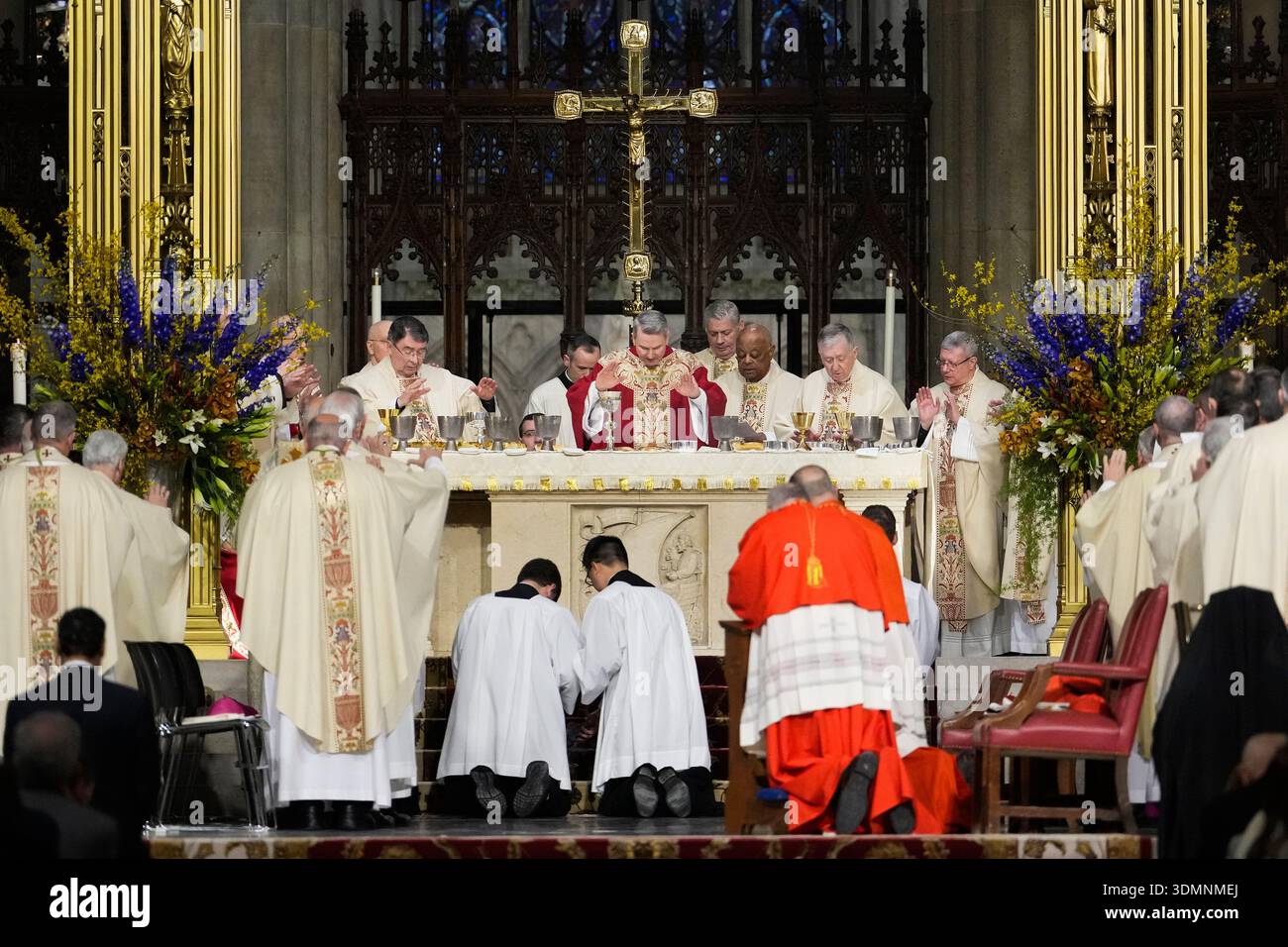 Archbishop Ronald Hicks says the prayer over the offerings during his ...