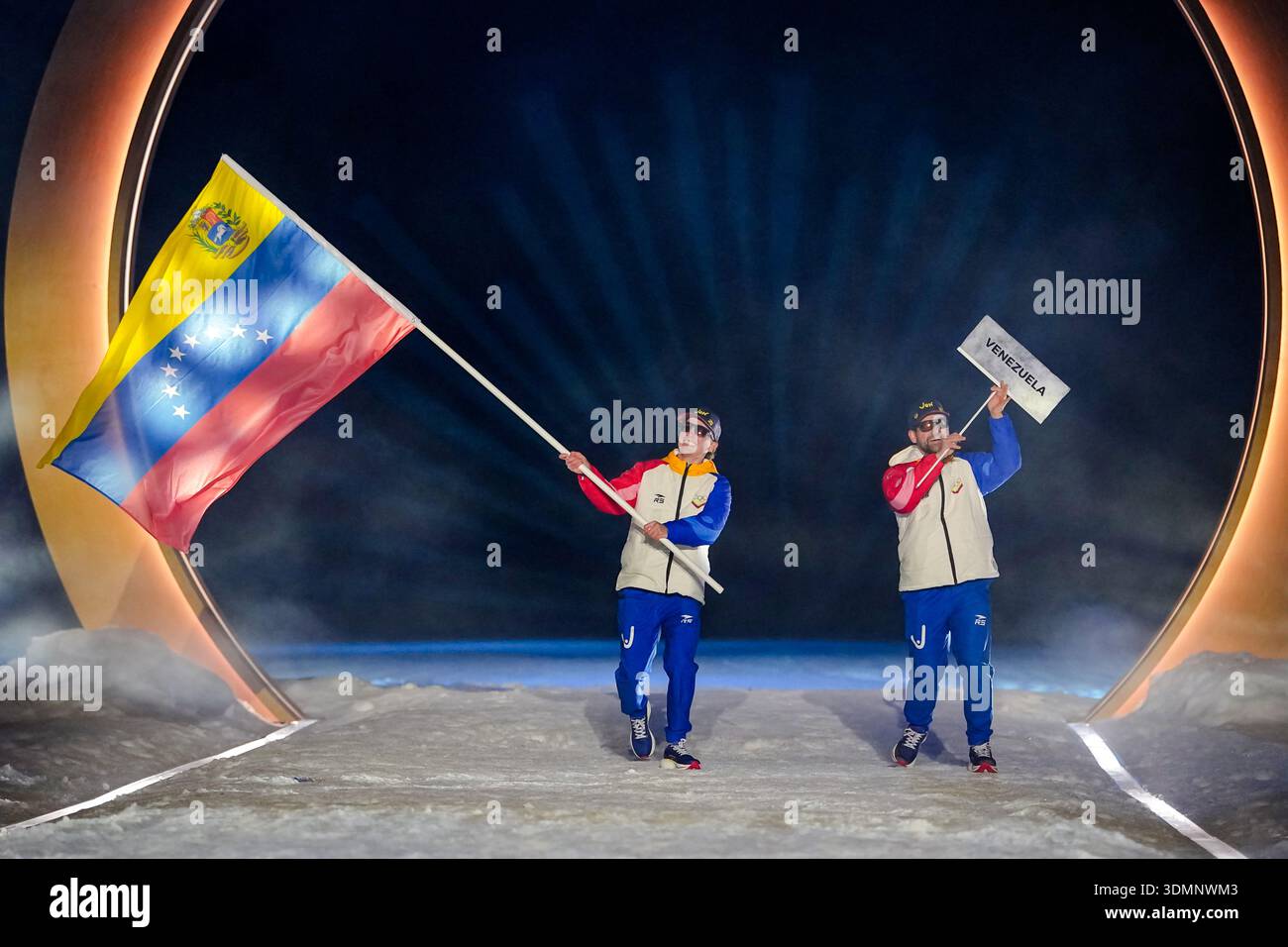 Nicolas Claveau-Laviolette, the flag bearer of Venezuela, takes part in ...