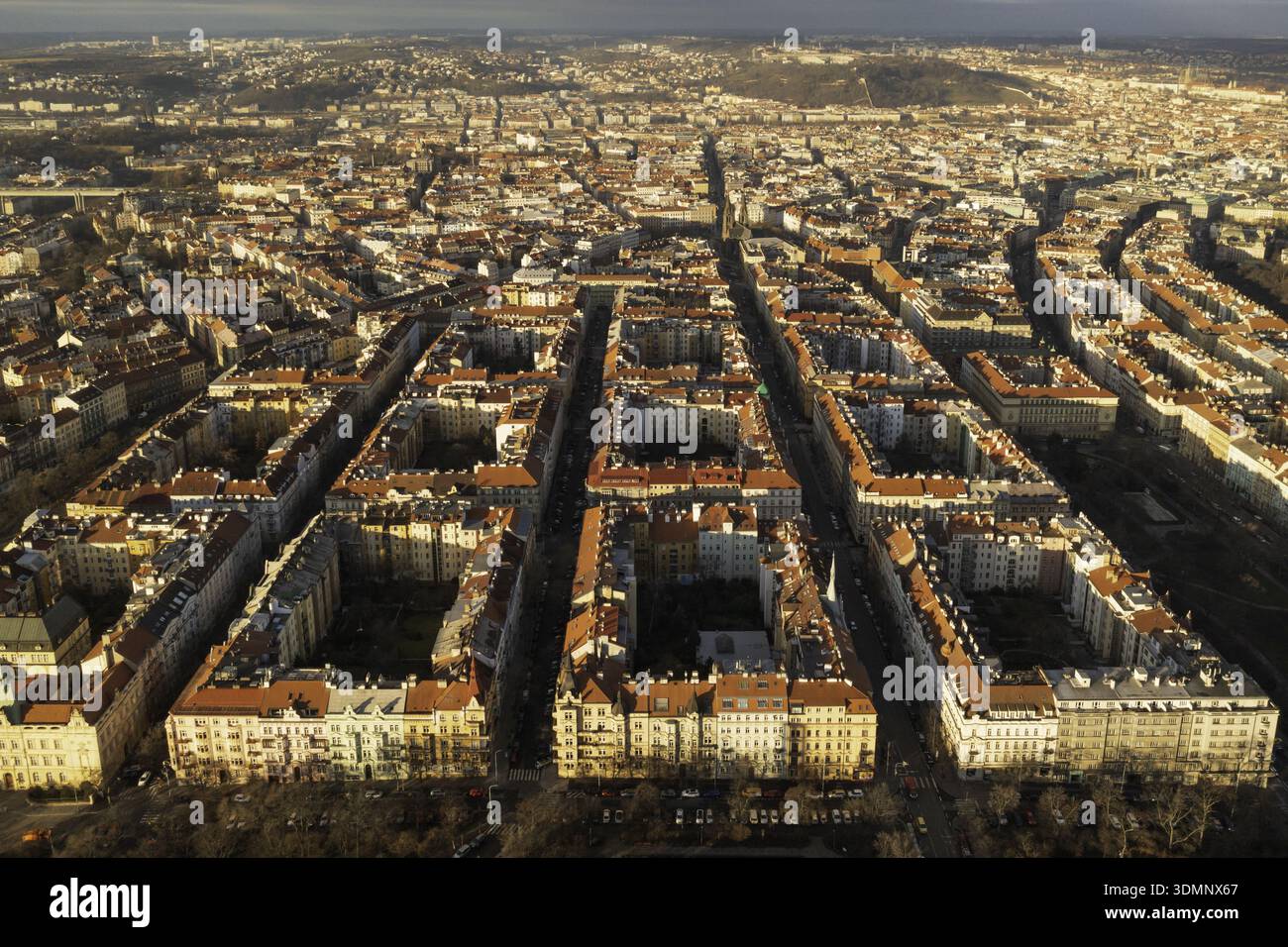 Aerial view of symmetrical buildings casting long shadows across the ...