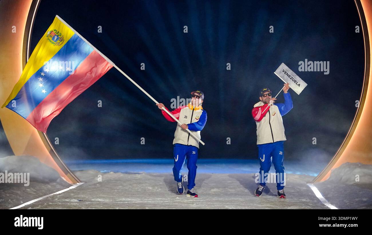 Nicolas Claveau-Laviolette, the flag bearer of Venezuela, takes part in ...