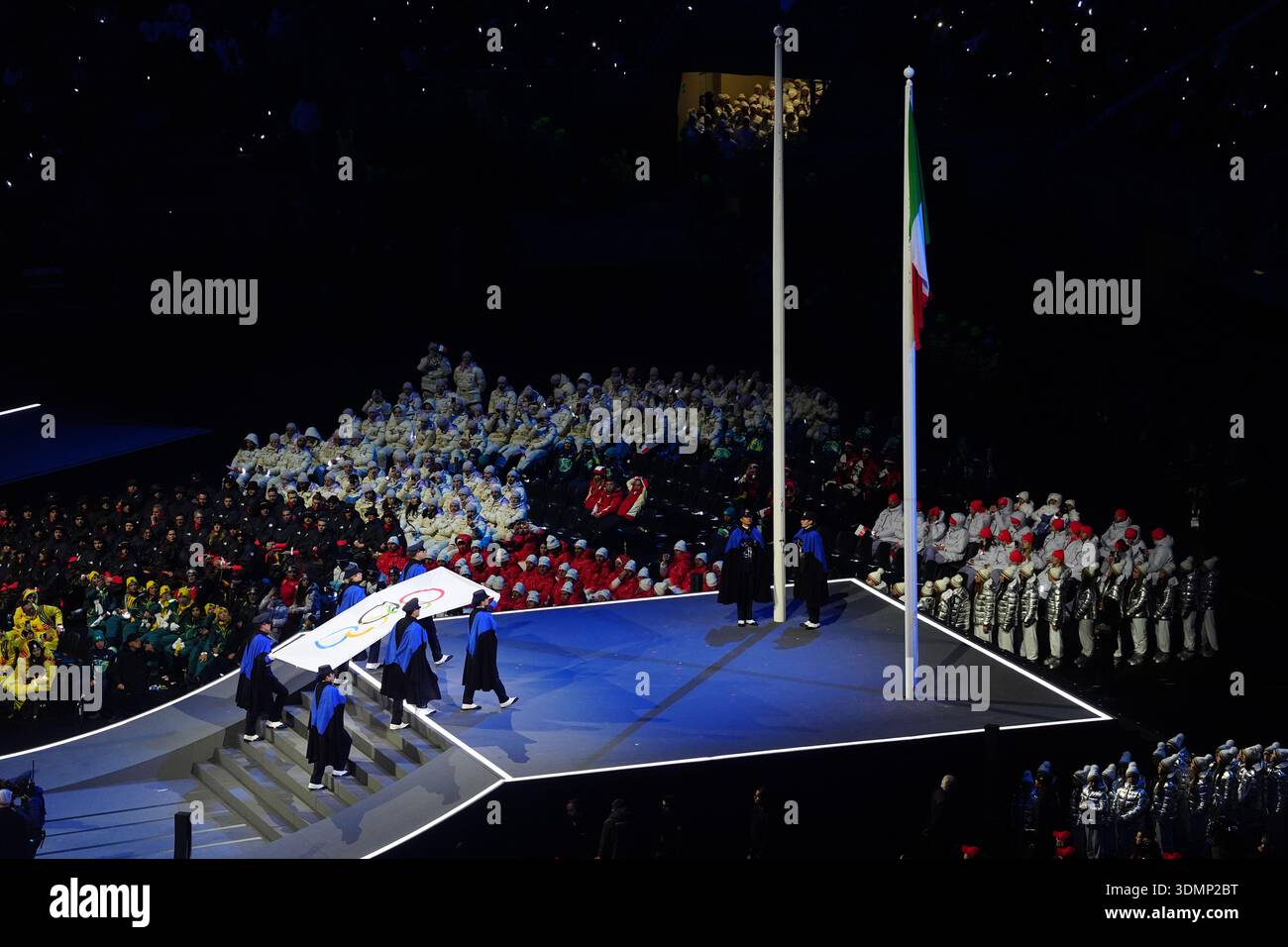 The Olympic flag is carried into the stadium during Opening Ceremony ...