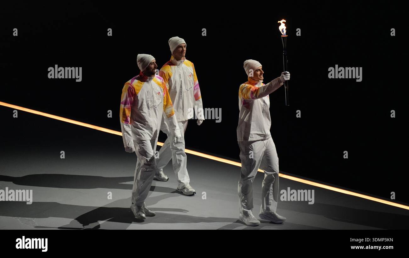 The Olympic torch is carried during the Olympic opening ceremony at the ...
