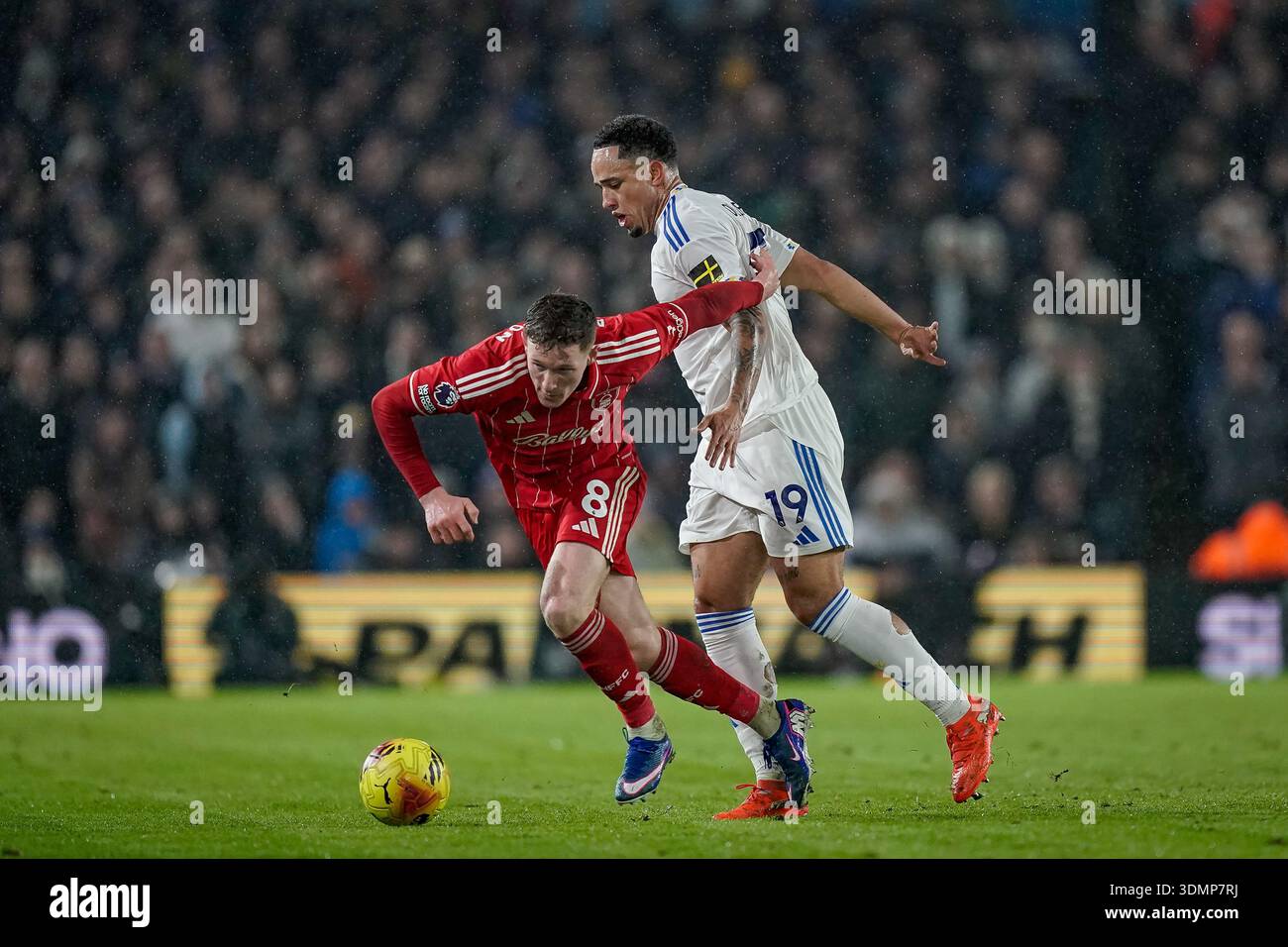 Elliot Anderson of Nottingham Forest is tackled by Noah Okafor of Leeds ...