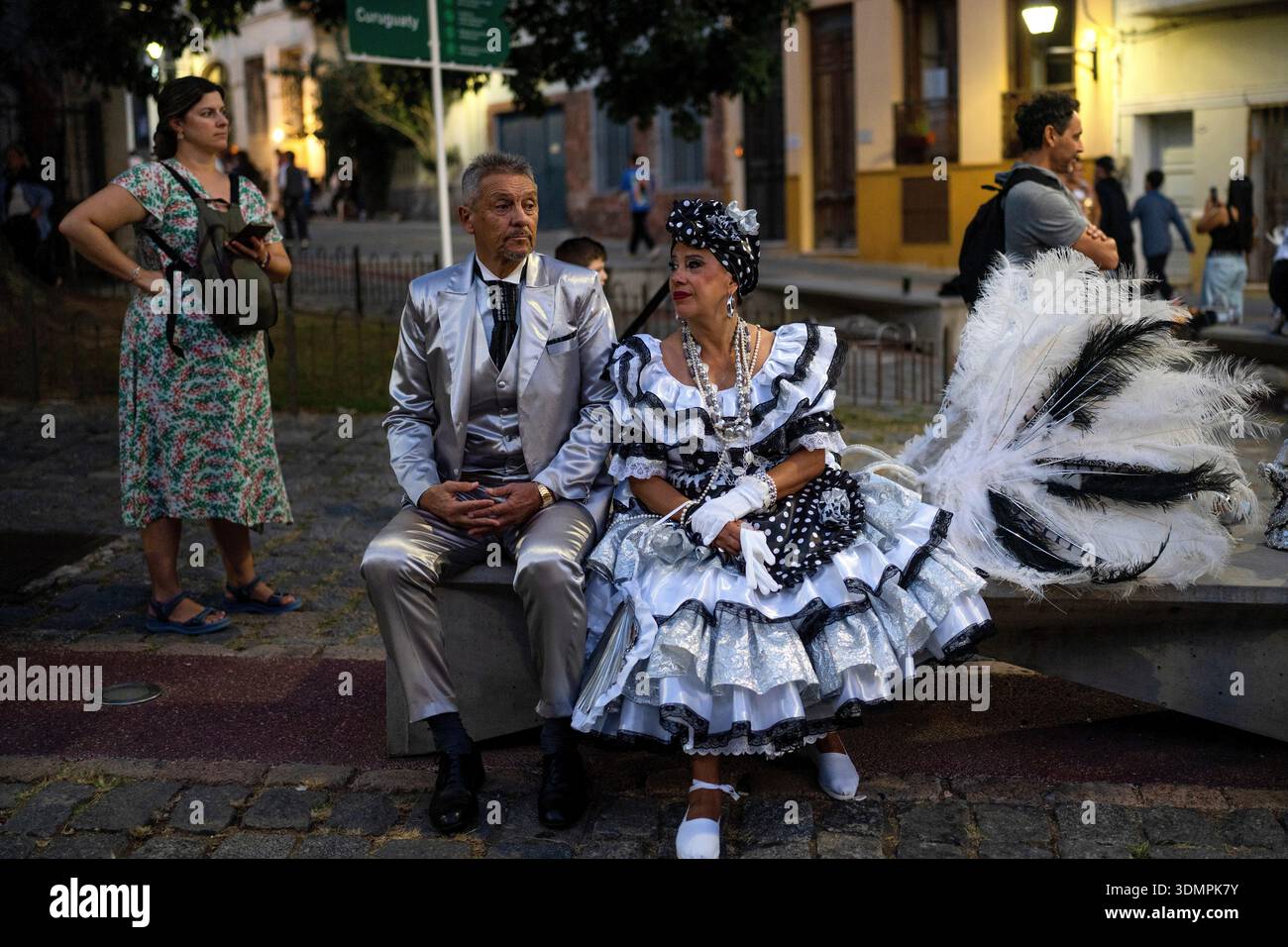 Carnival characters known as a Gramillero and Mama Vieja, wait for the ...