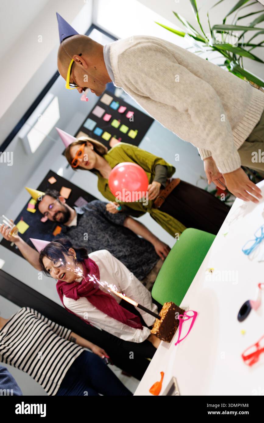 Business team celebrates milestone with a cheerful party in modern ...