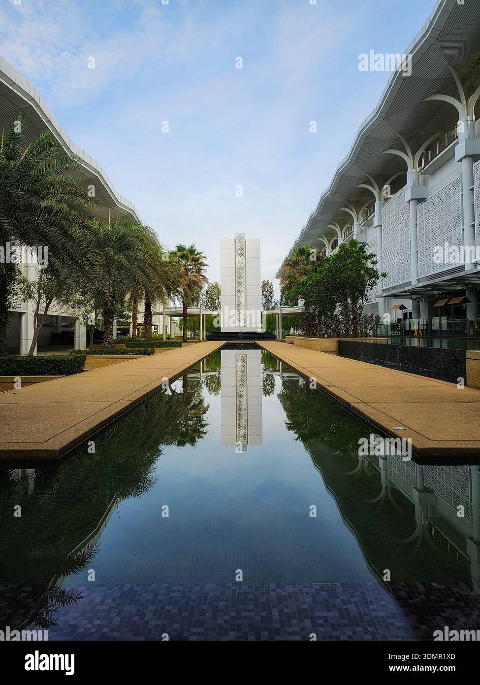 Modern Islamic architecture and a long reflecting pool at the Mövenpick ...
