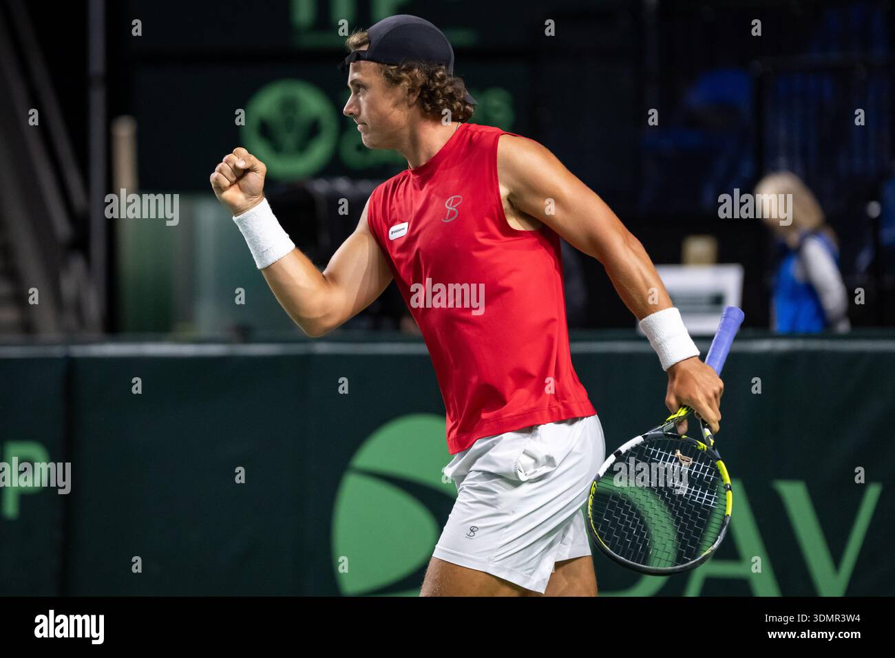 Canada's Liam Draxl celebrates winning a point against Brazil's Joao ...