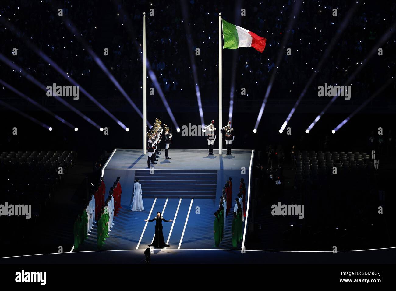 The Italian flag is raised during the opening ceremony of the Milan ...