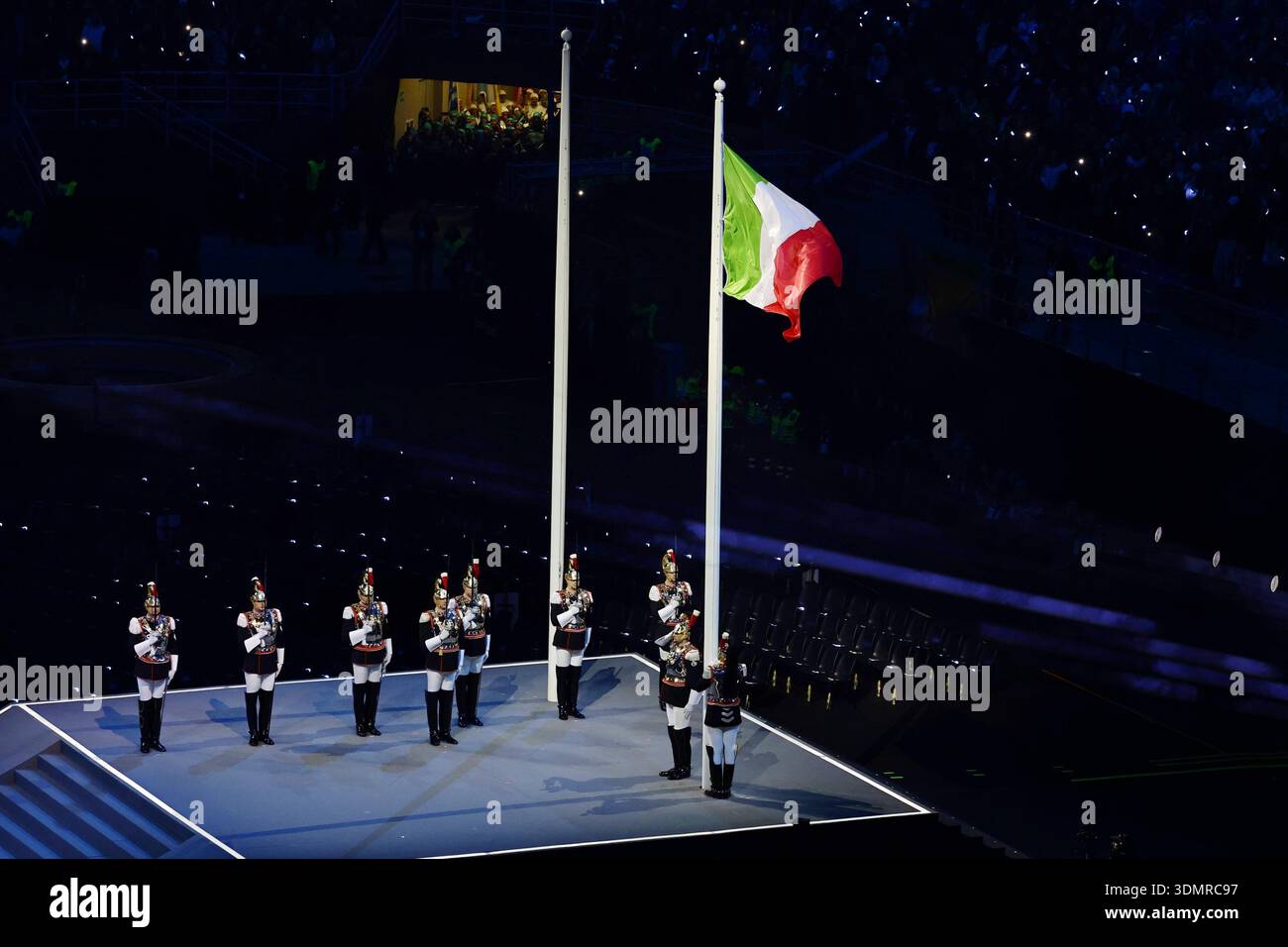 The Italian flag is raised during the opening ceremony of the Milan ...