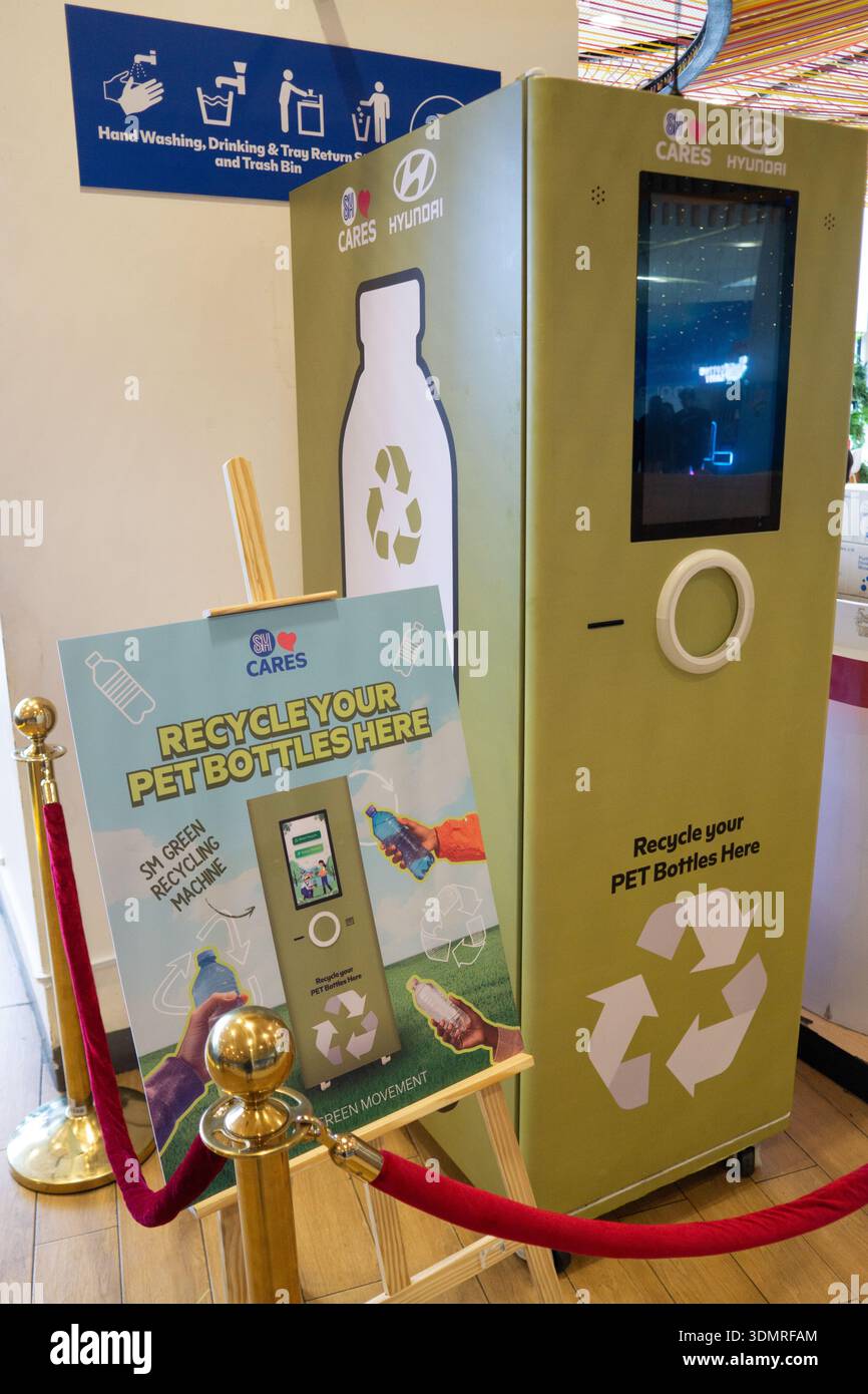 Plastic bottle recycling machine installed inside modern shopping mall ...