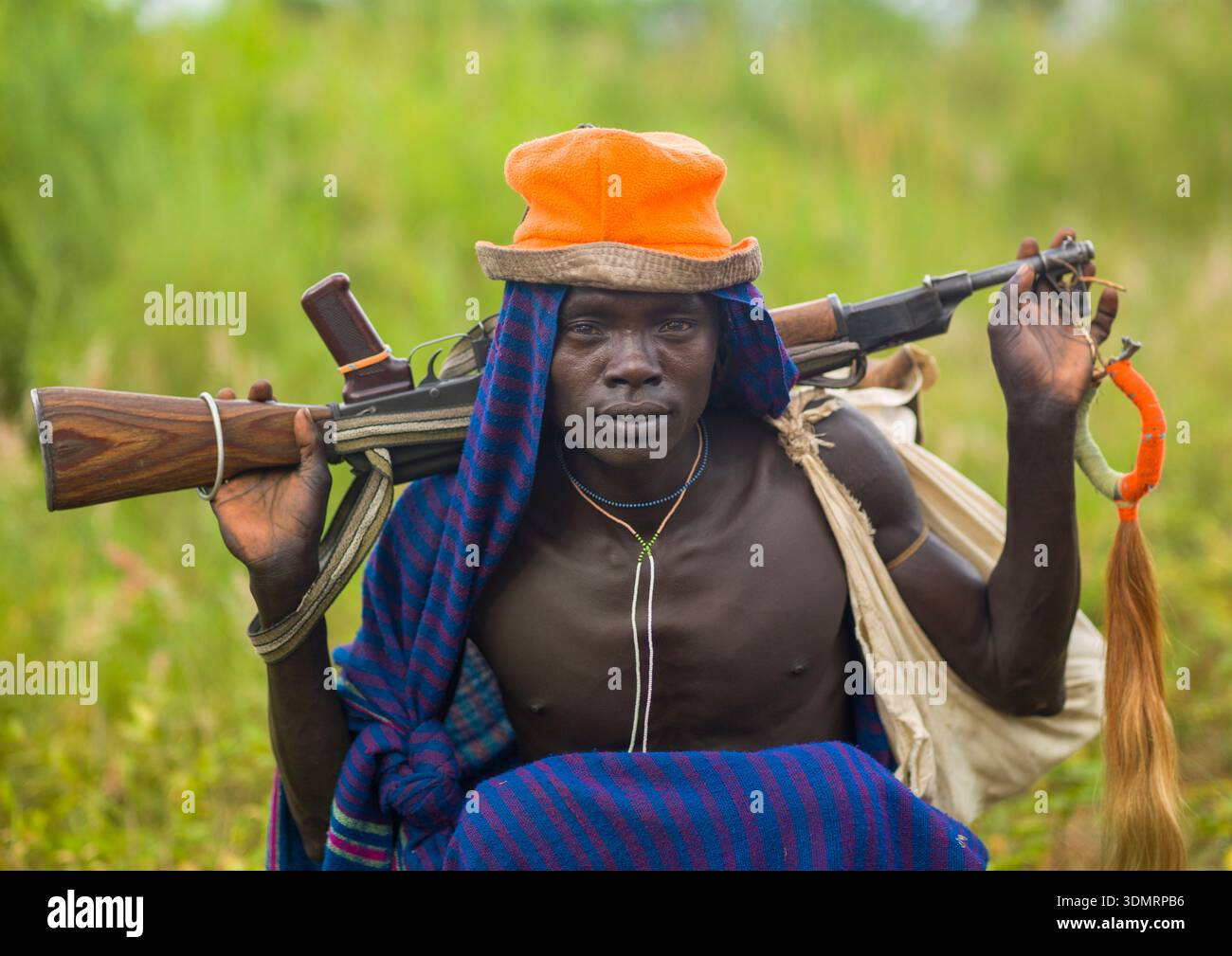 Portrait of a Surma man with a kalashnikov, Omo valley, Kibish ...