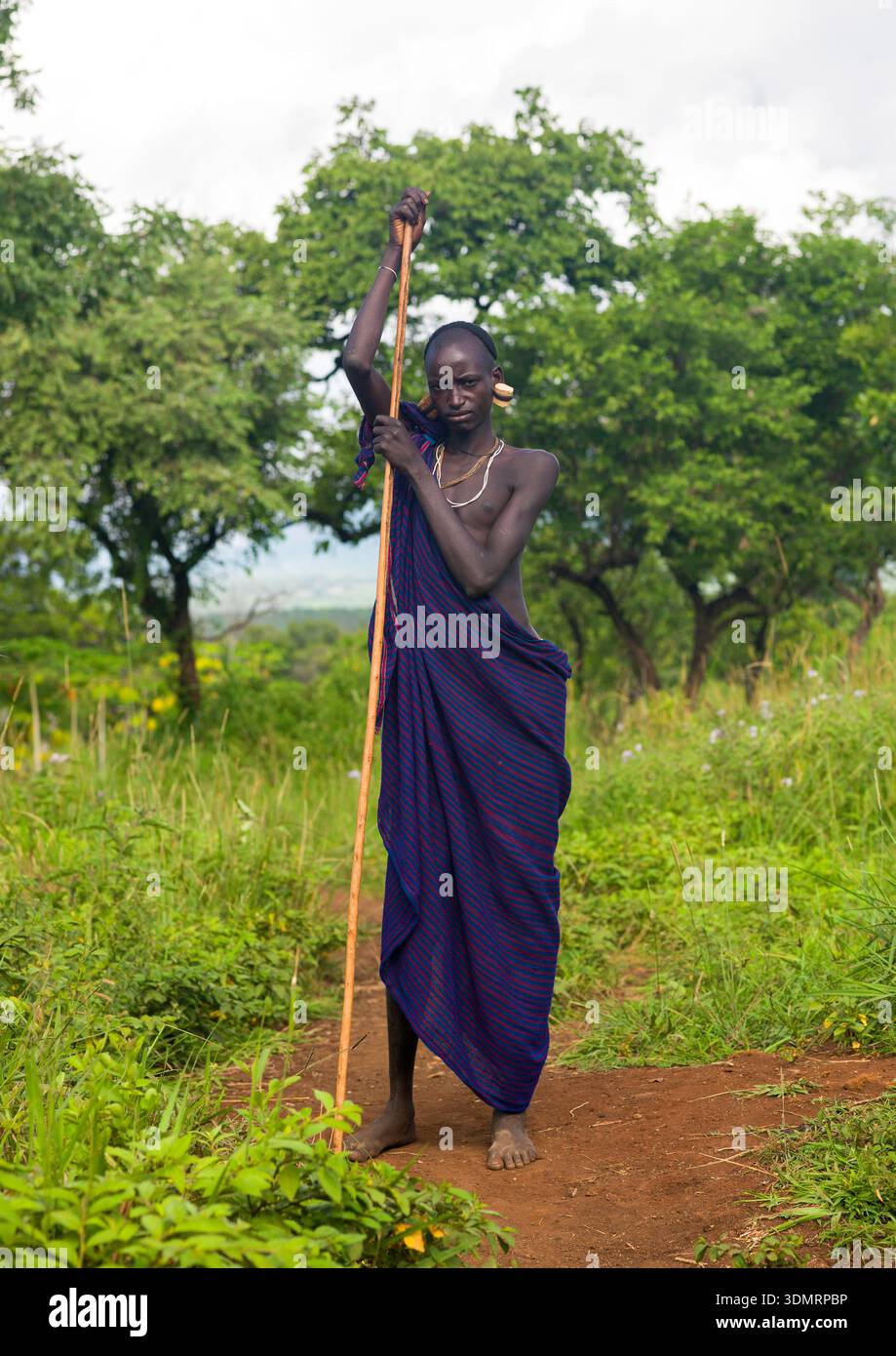 Surma man with a stick, Omo valley, Kibish, Ethiopia Stock Photo - Alamy