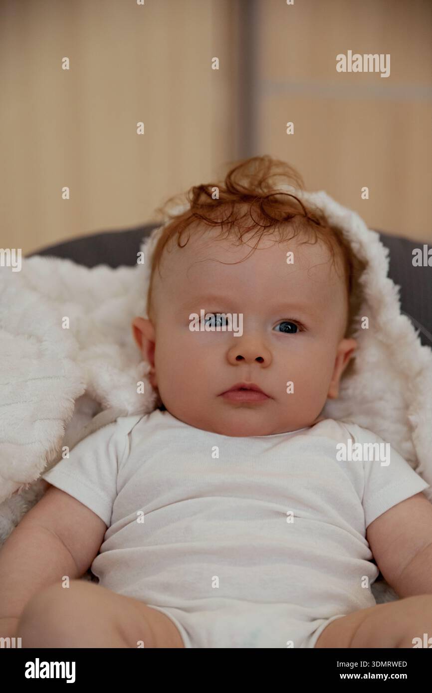 Baby curly hair sits hi-res stock photography and images - Alamy