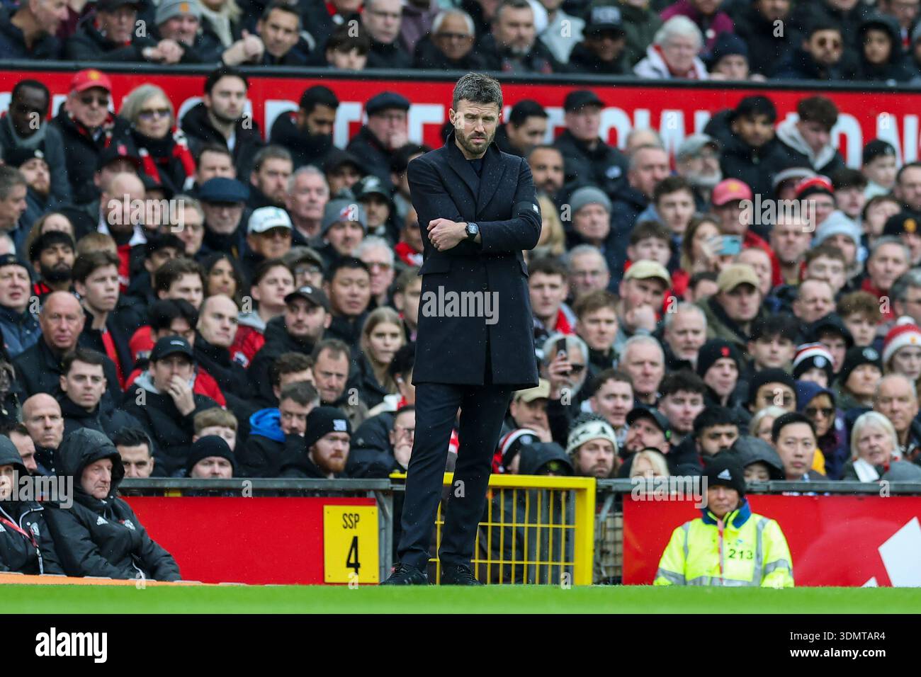 Manchester United head coach Michael Carrick looks on in the rain ...