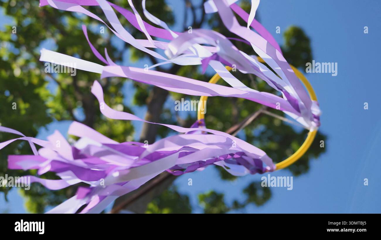 Purple ribbons dancing in hi-res stock photography and images - Alamy