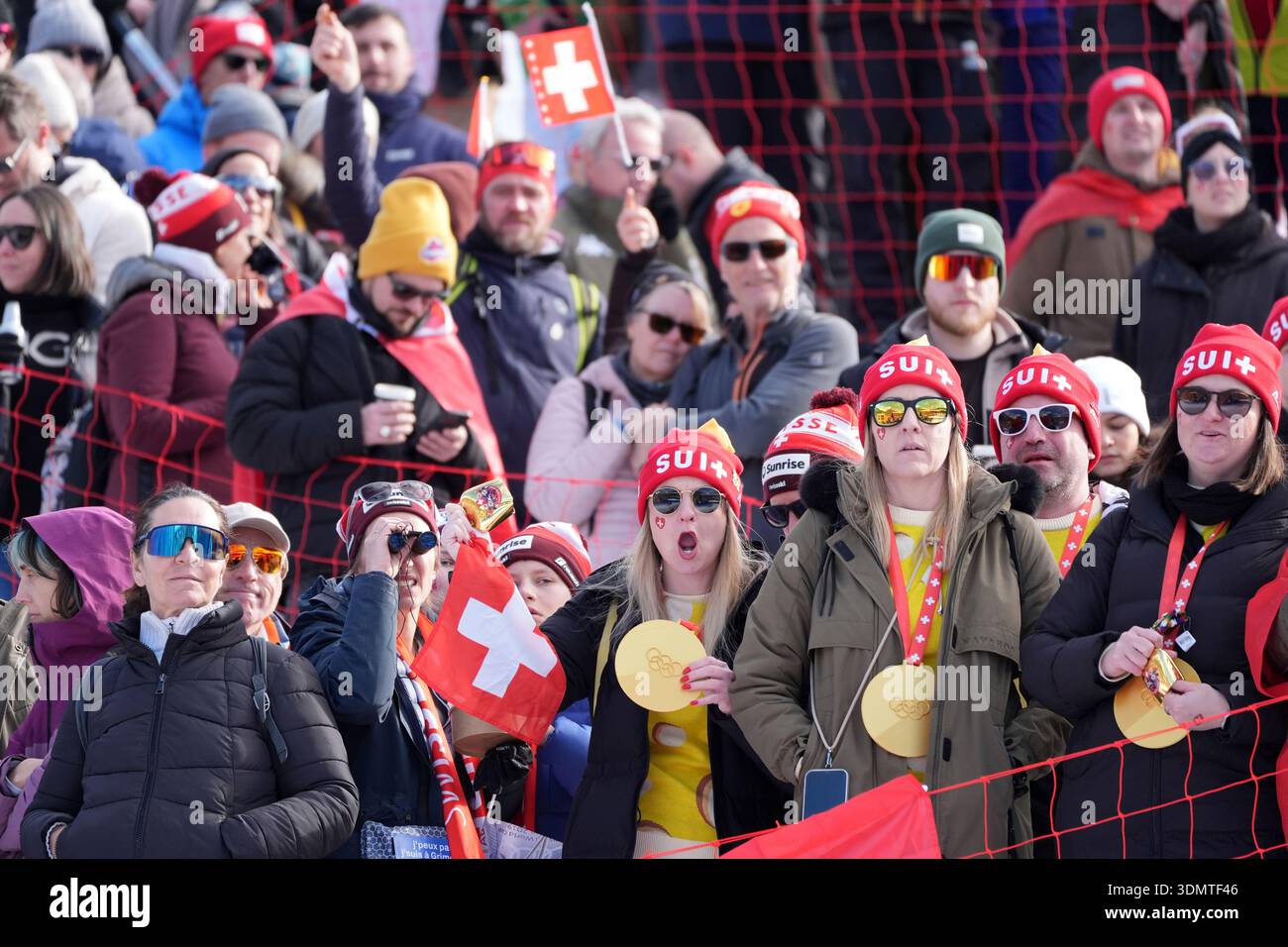 Swiss athletes cheer at the finish area of an alpine ski men's downhill ...