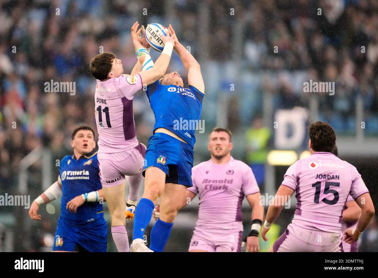 Scotland's Jamie Dobie, left, and Italy's Louis Lynagh stretch for a ...