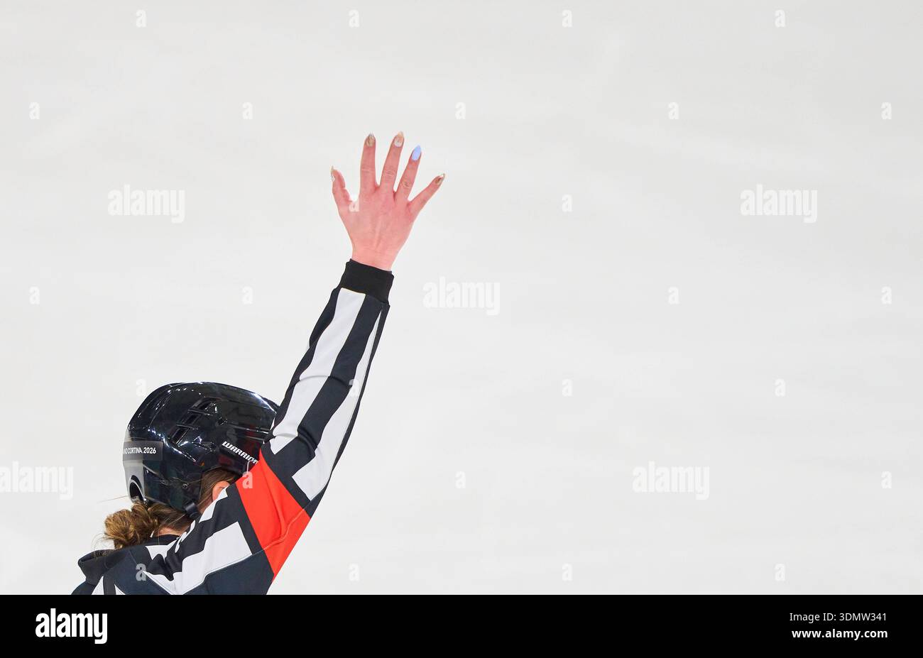 Referee with long fingernails at the preliminary women Ice Hockey match ...