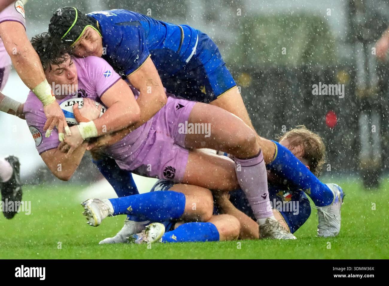 Scotland's Tom Jordan, left, and Italy's Juan Ignacio Brex in action ...
