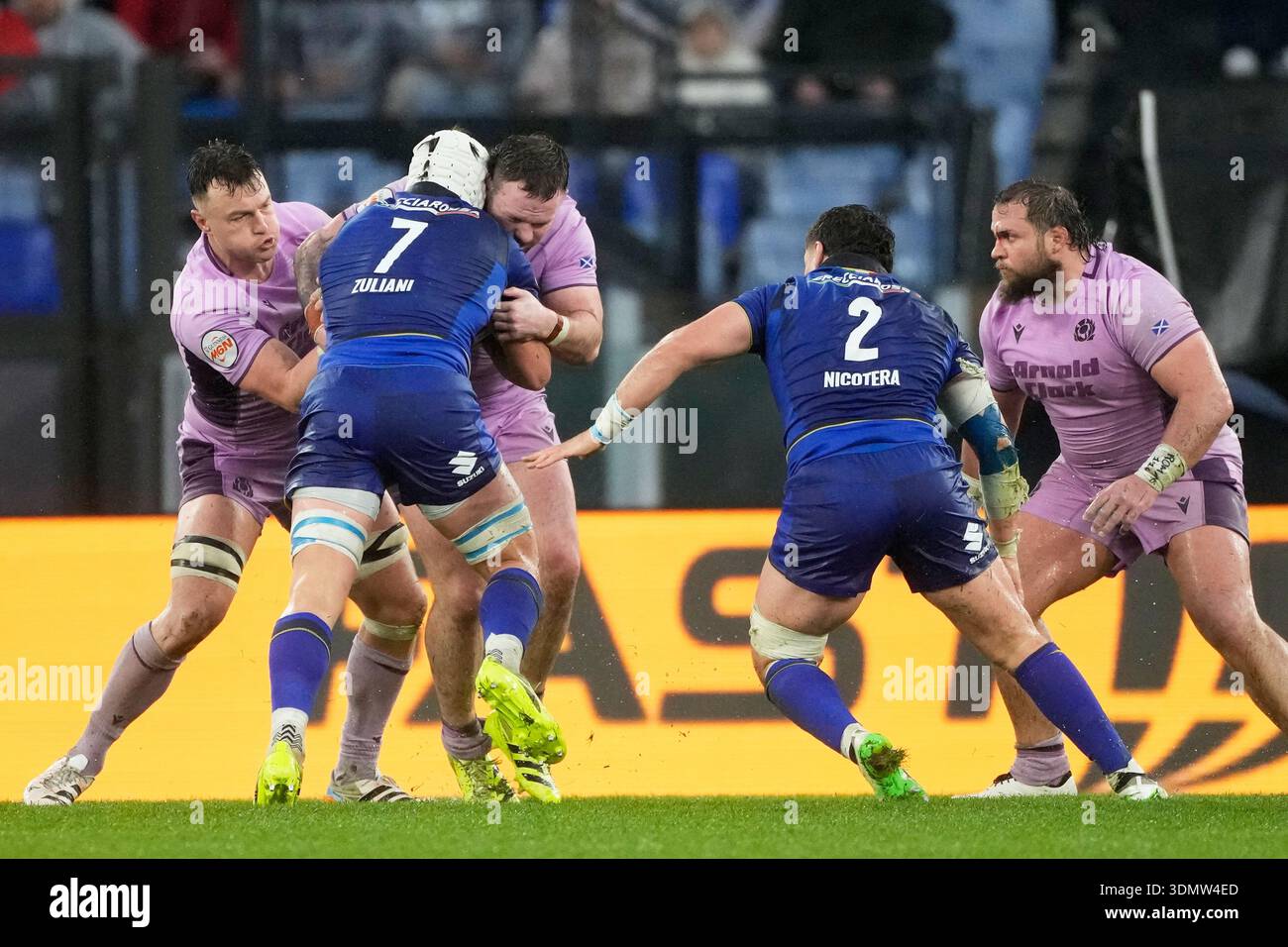 Scotland's Ewan Ashman, third from left, tackles Italy's Manuel Zuliani ...