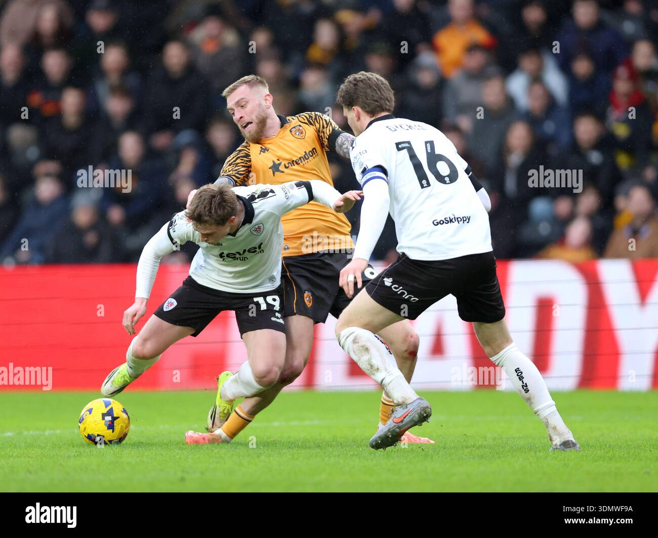 Hull City's Oliver McBurnie battles for the ball with Bristol City's ...