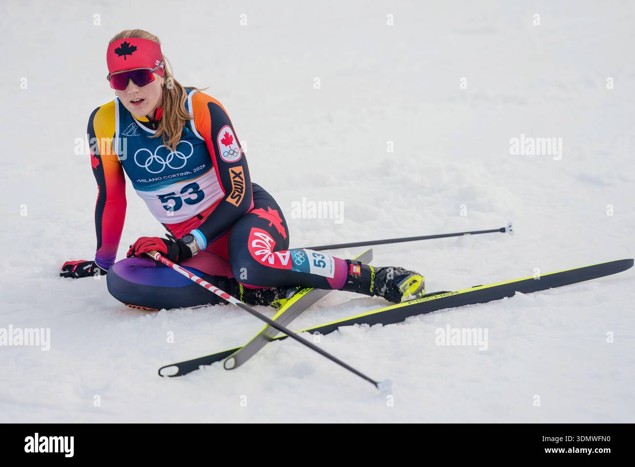 Amelia Wells of Canada rests on the ground after finishing the cross ...